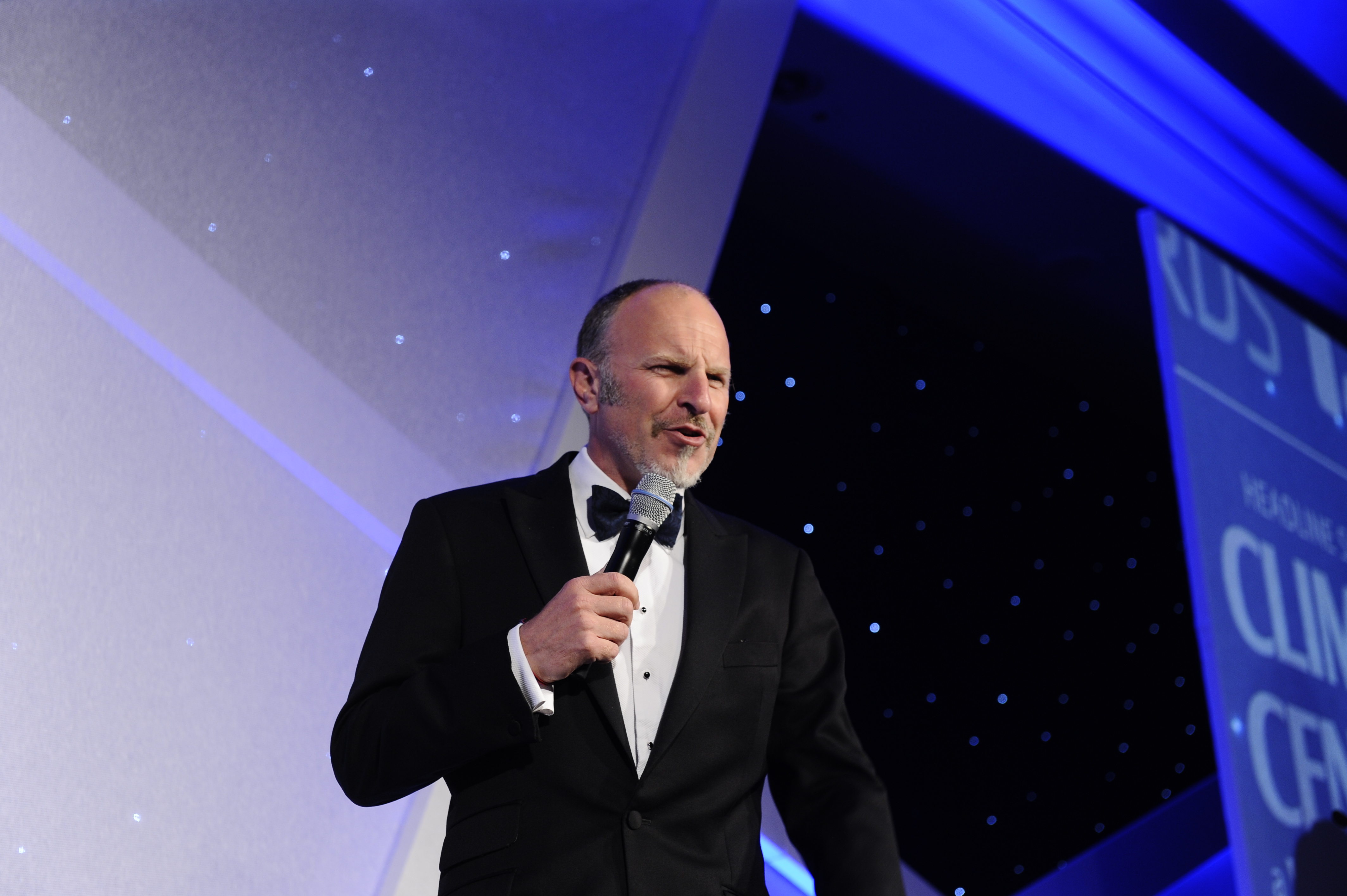 Can you be funny about economics? Cooling Awards host Simon Evans ...