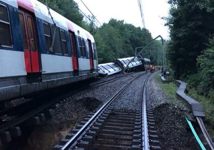 Seven injured as Paris train derails following embankment collapse ...