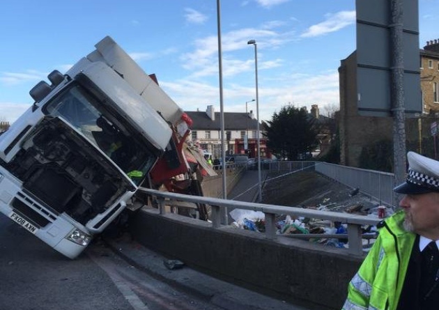 Overturned truck at busy London roundabout spills rubbish | MRW