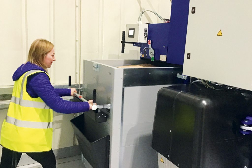 Staff simply slot in a cart to begin baling process | MRW