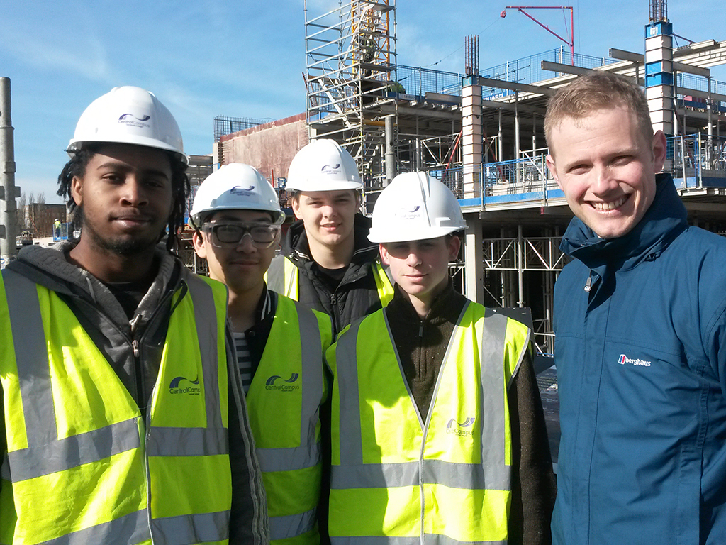 University students work on construction of new campus buildings ...