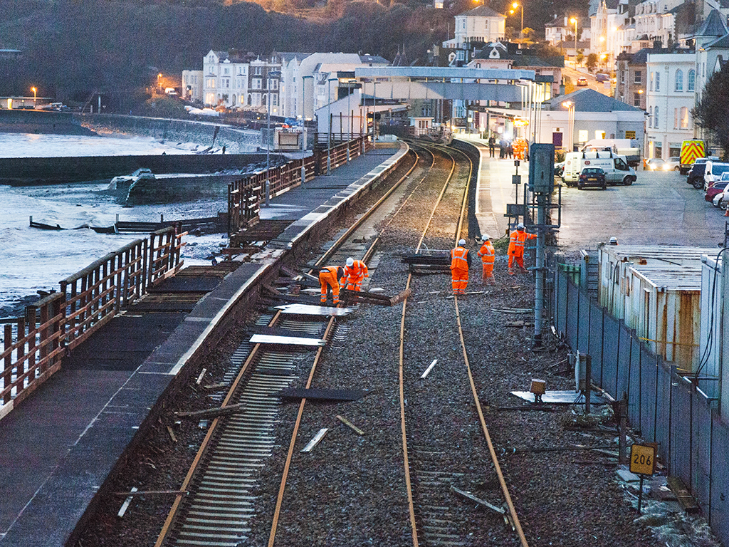 Storm-battered rail line to get further £37m defence aid | Construction ...