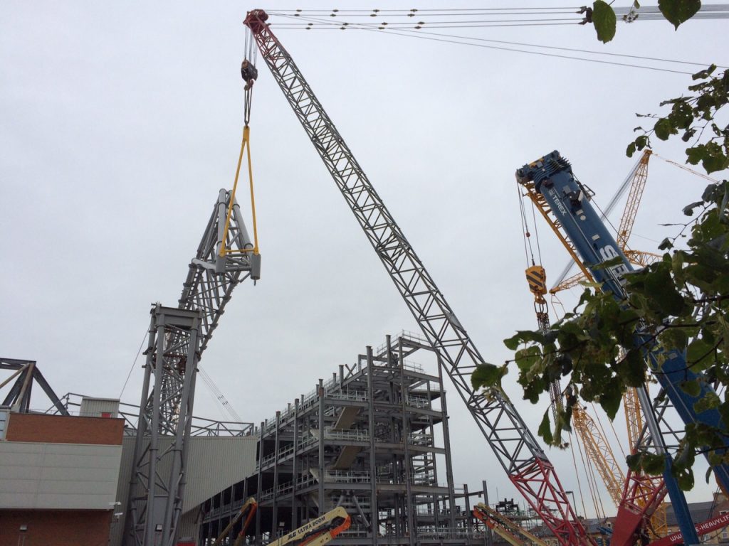 Massive main truss lifted over existing stand at Anfield - more images ...