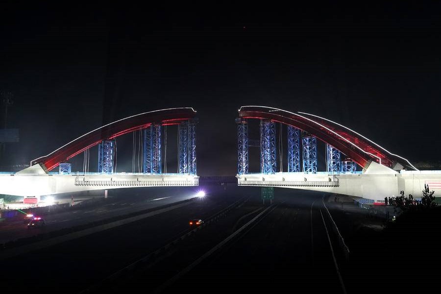 China rotates two halves of 231m long bridge into place over major ...