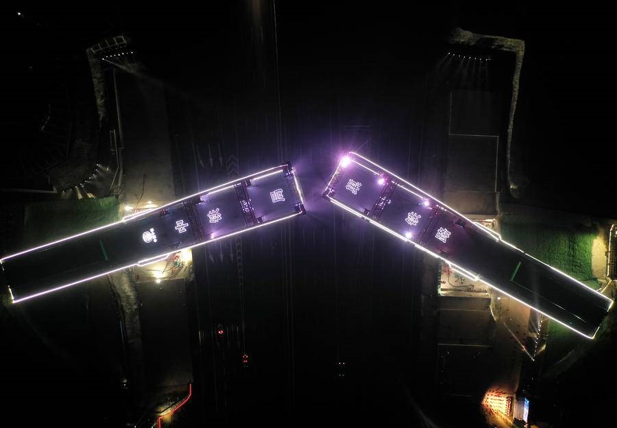 China rotates two halves of 231m long bridge into place over major ...