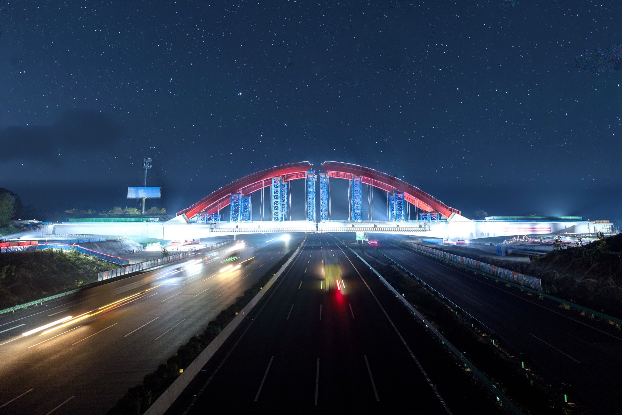 China rotates two halves of 231m long bridge into place over major ...
