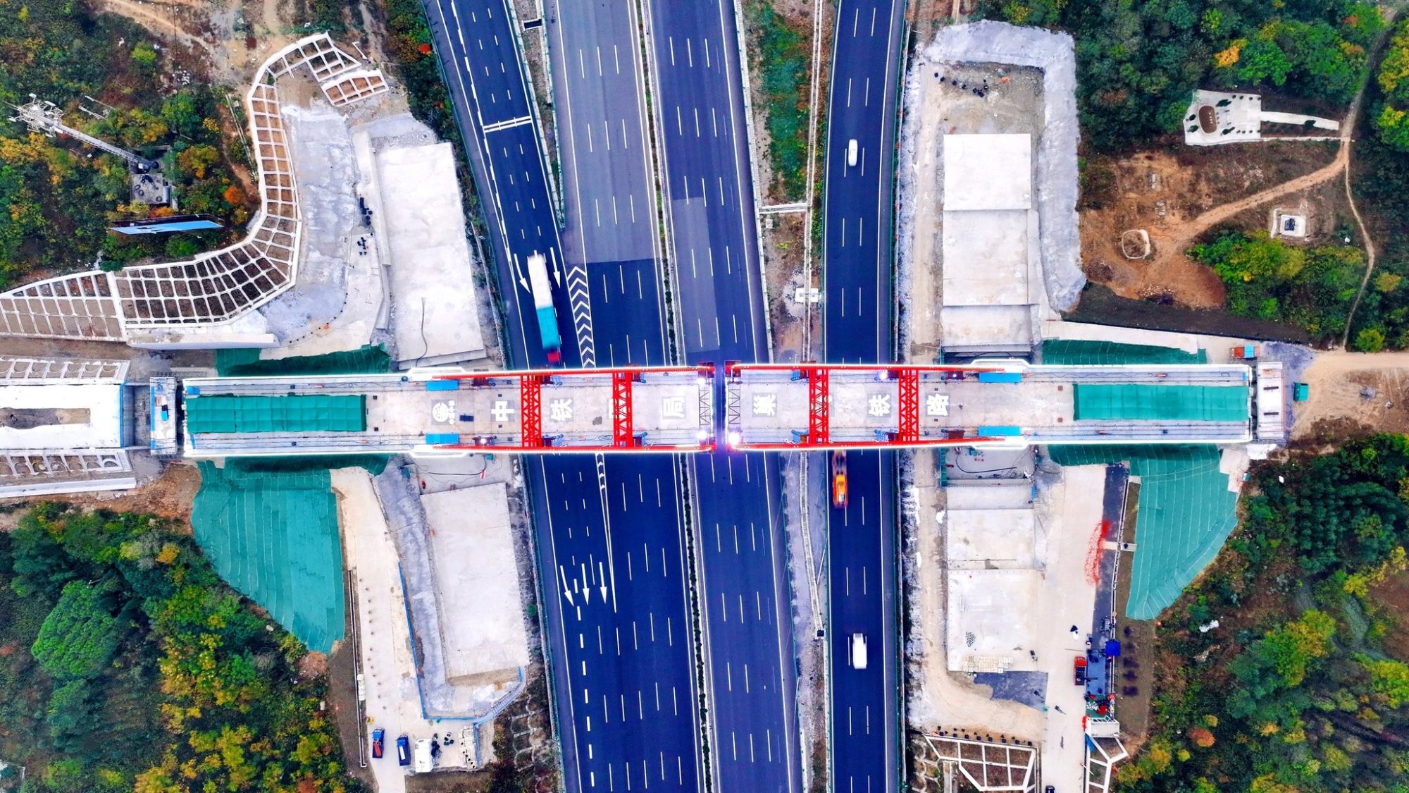 China rotates two halves of 231m long bridge into place over major ...