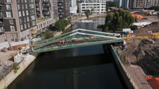 Watch a 320t footbridge sail down an East London waterway for ...
