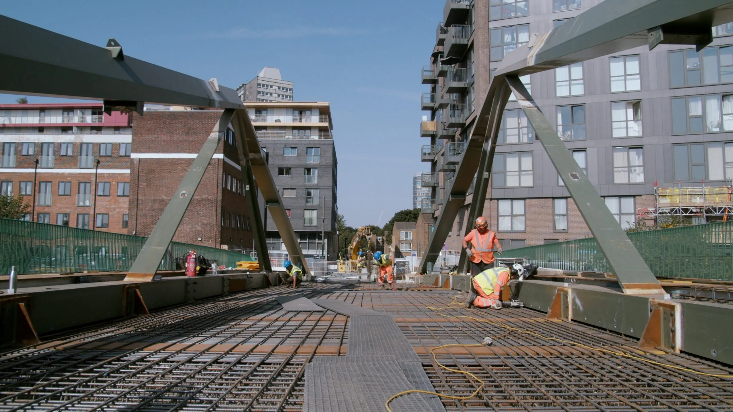 Watch a 320t footbridge sail down an East London waterway for ...