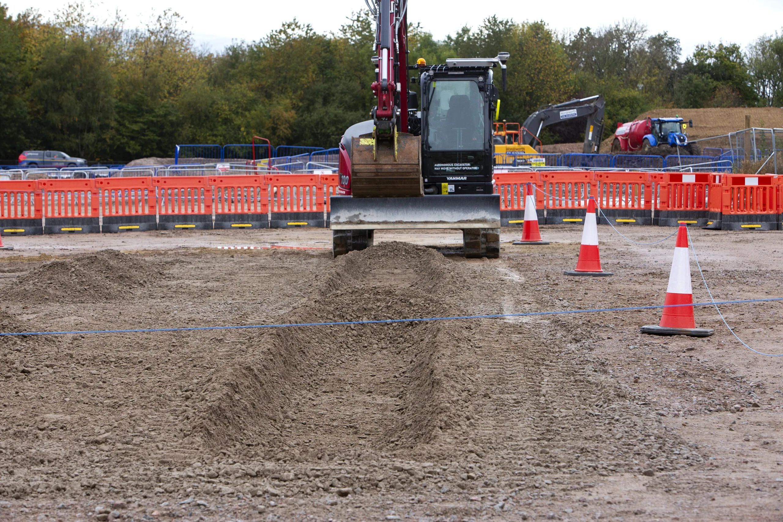 Watch: UK first trial of autonomous excavator helping to build car park ...